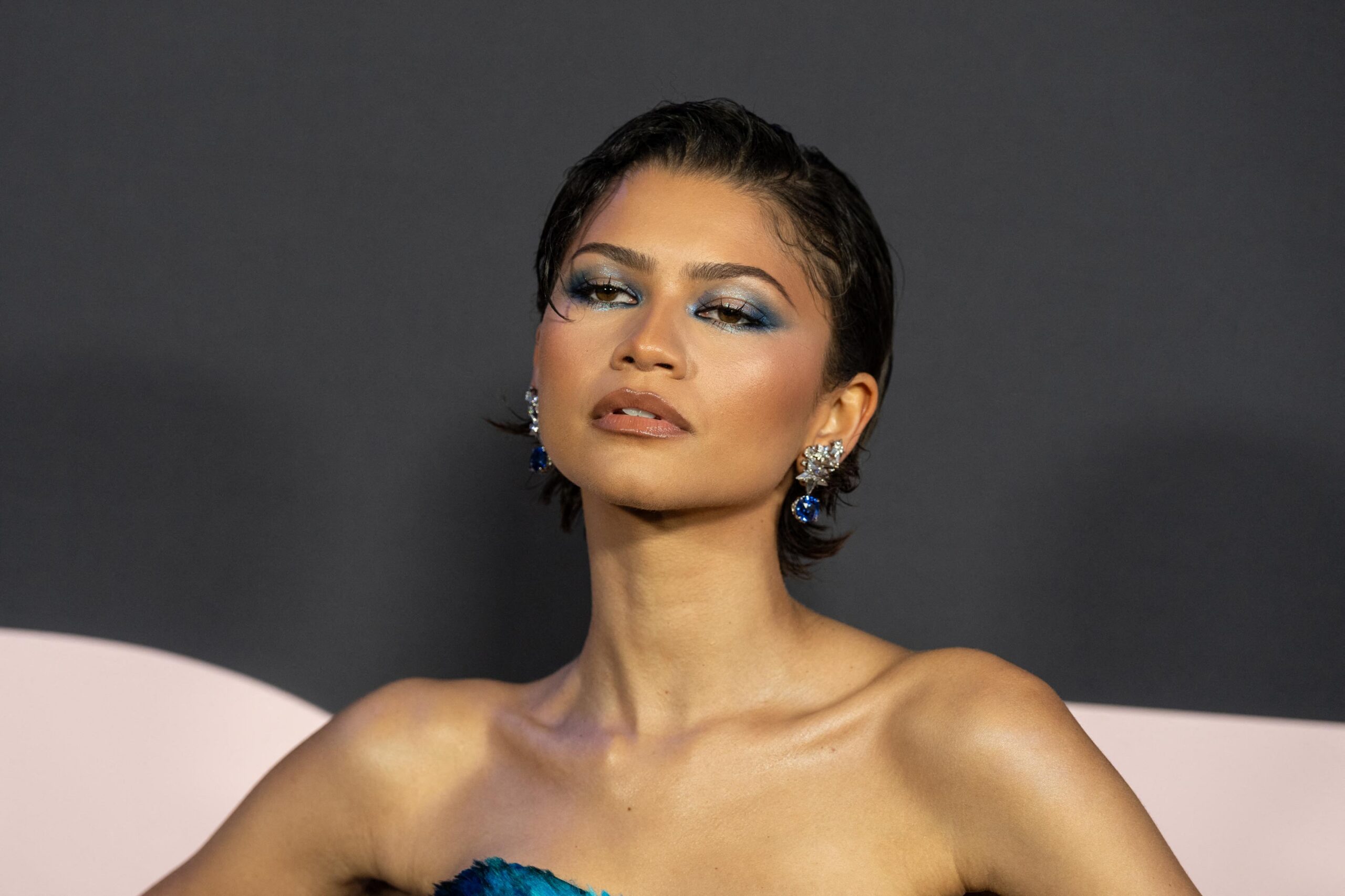 Zendaya Sparks Pregnancy Rumors In Loose Gown At LV Show